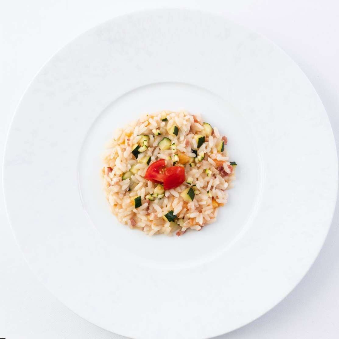 \イベリコベーコン トマト ズッキーニのリゾット ／Bel e Moco メインのご紹介梁 | 本格イタリアンレストラン Bel e Moco (ベルエモコ)